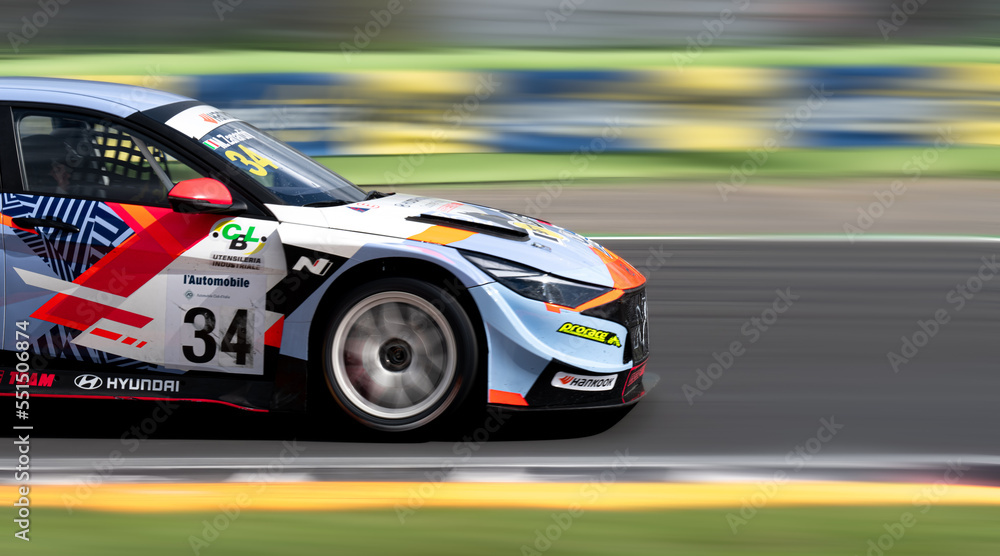 Spectacular fast speed race car front section detail blurred motion ...