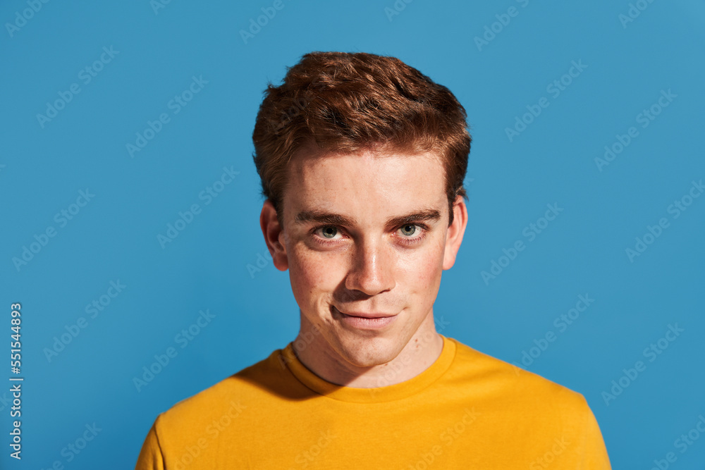 Smug young man looking at camera Stock Photo | Adobe Stock