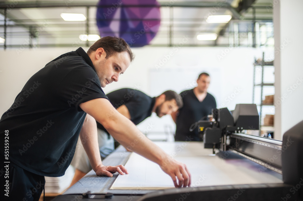 Professional workers graphic technicians operators work in a printing ... Professional workers graphic technicians operators work in a printing ...