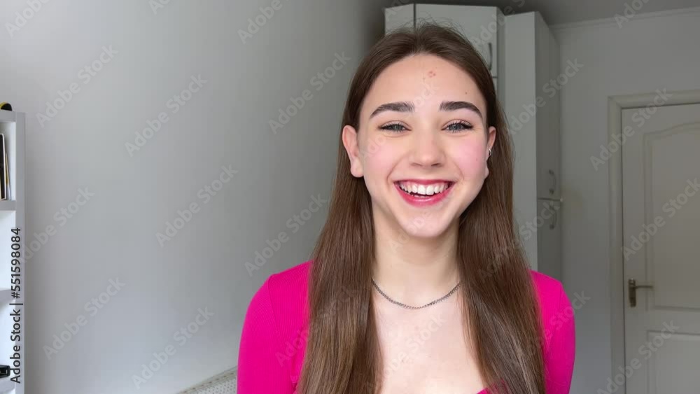 Happy mature young girl lady sitting on couch, holding video call with ...