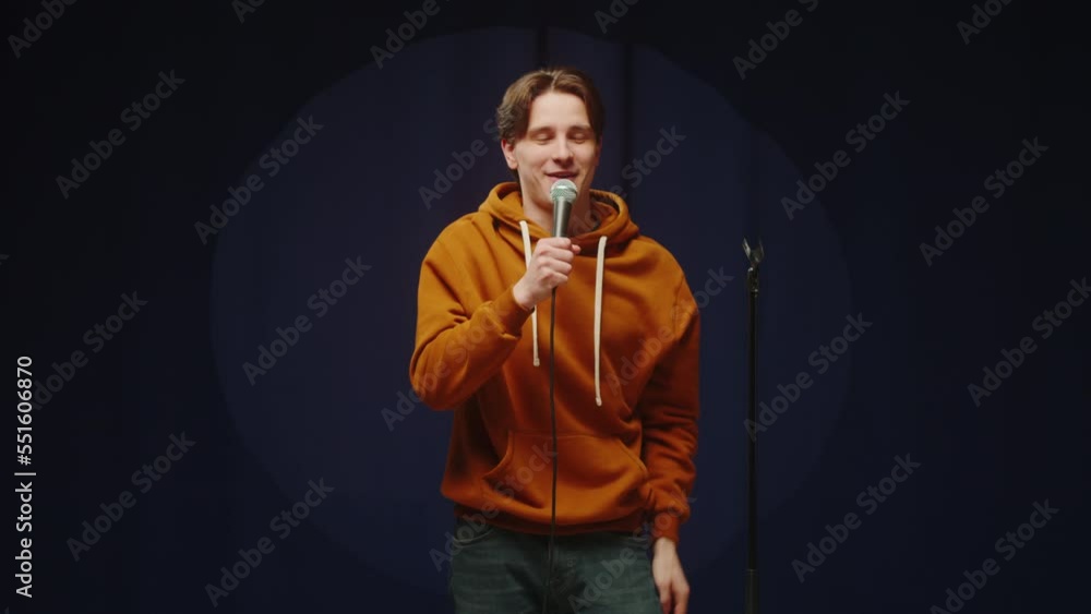 StandUp cafe, comedy concert. Man telling jokes on stage. Male comedian ...