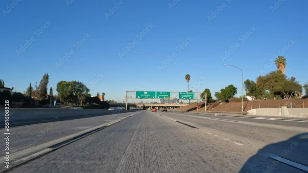 Driving view of the Los Angeles 101 Freeway interchange overhead sign ...
