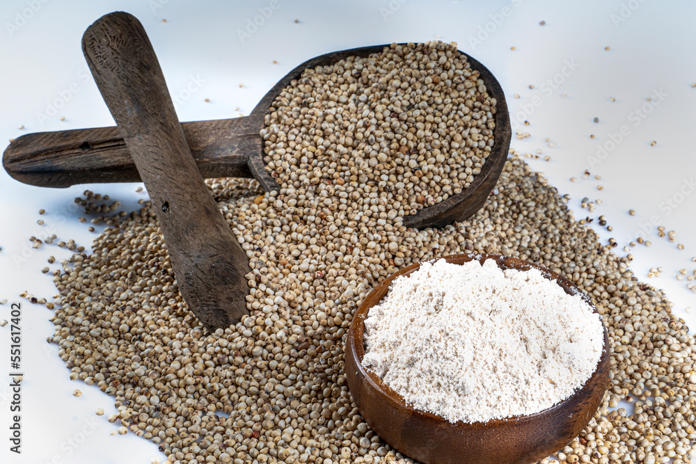 Top view of Sorghum grains and sorghum flour on white background ...