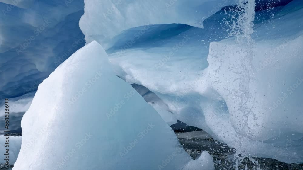 Blue white ice of glacier inside of ice cave. Glacier melting down and ...