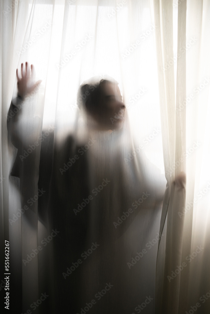 Silhouette of a man trapped behind a curtain Stock Photo | Adobe Stock