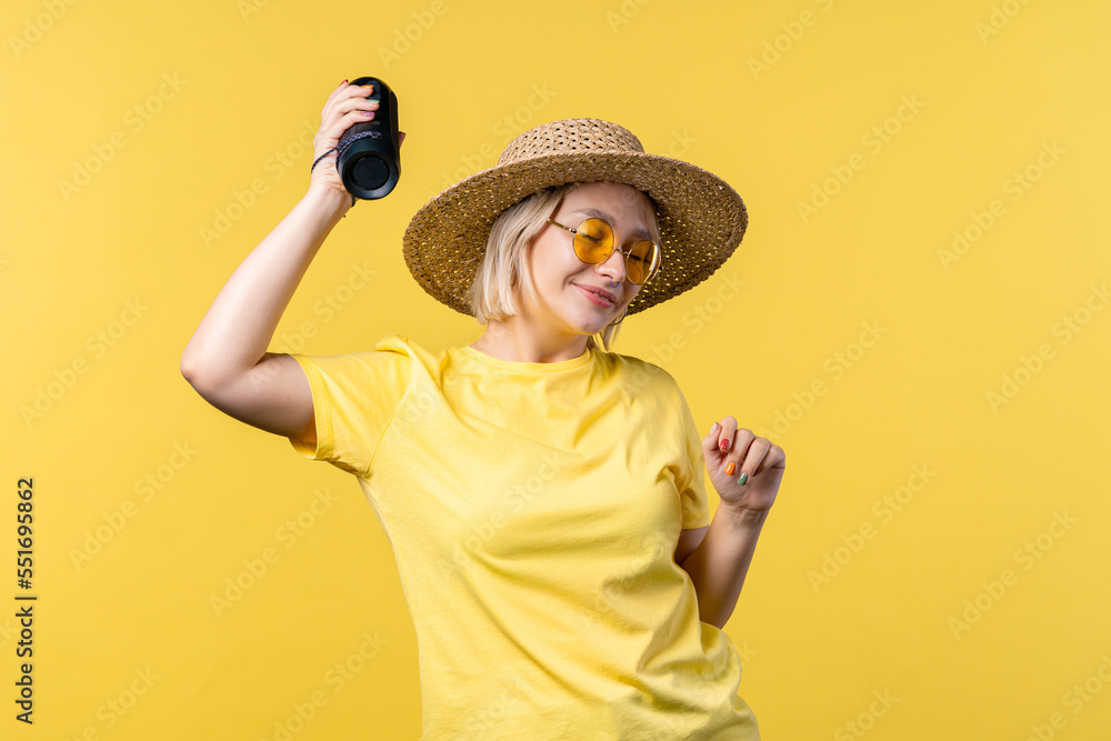 Lady dancing, enjoying on yellow studio background. She moves to rhythm ...