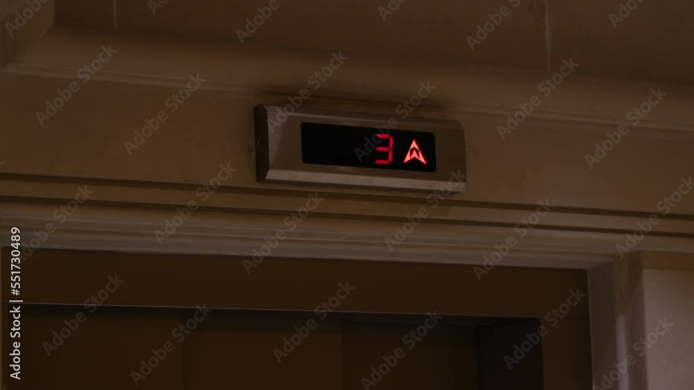 4K video with the led digits display of an elevator climbing from ...