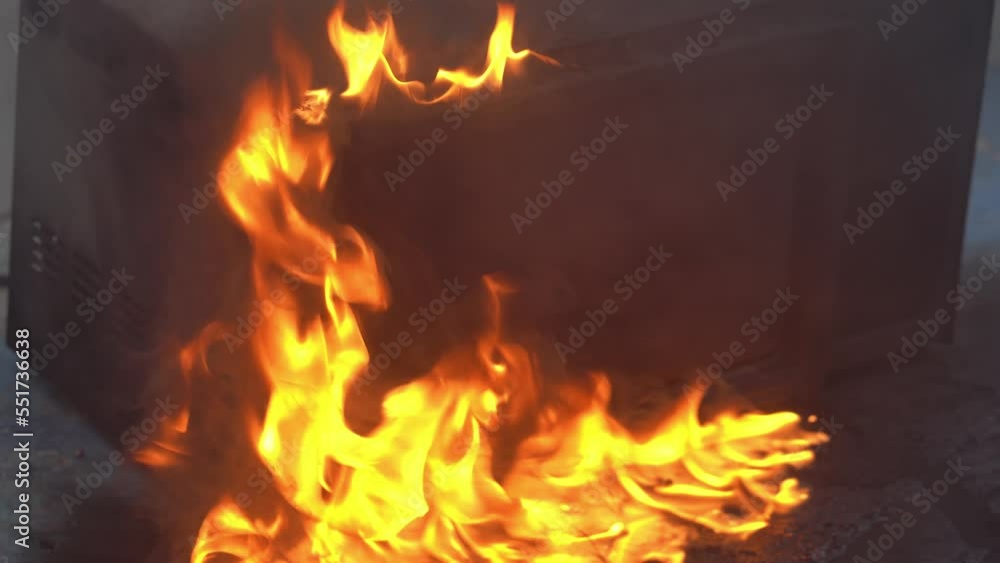 microwave oven on fire. the concept of fire in the kitchen and ...