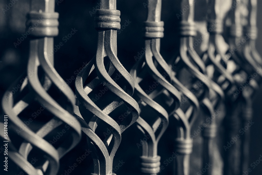 Black wrought iron front garden. Metal fence made of forged steel ...