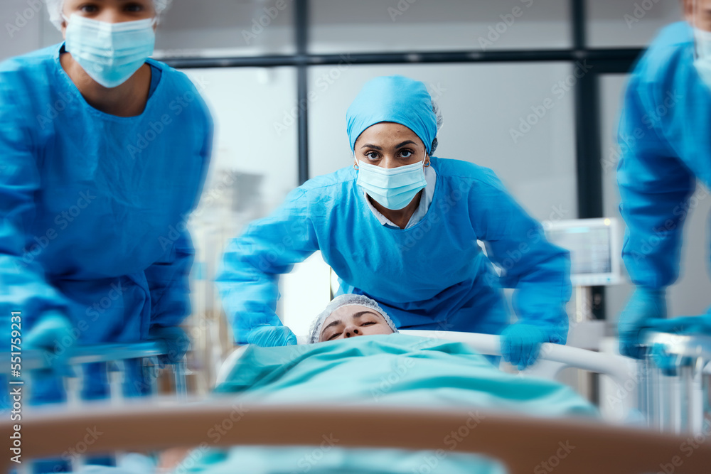 Surgeon, bed and rush in a hospital for emergency operation in the er ...