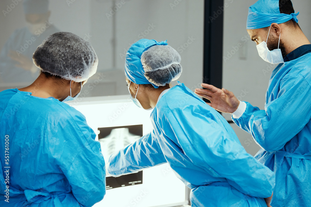 Surgery, xray and medical team analyze image before an operation in a ...