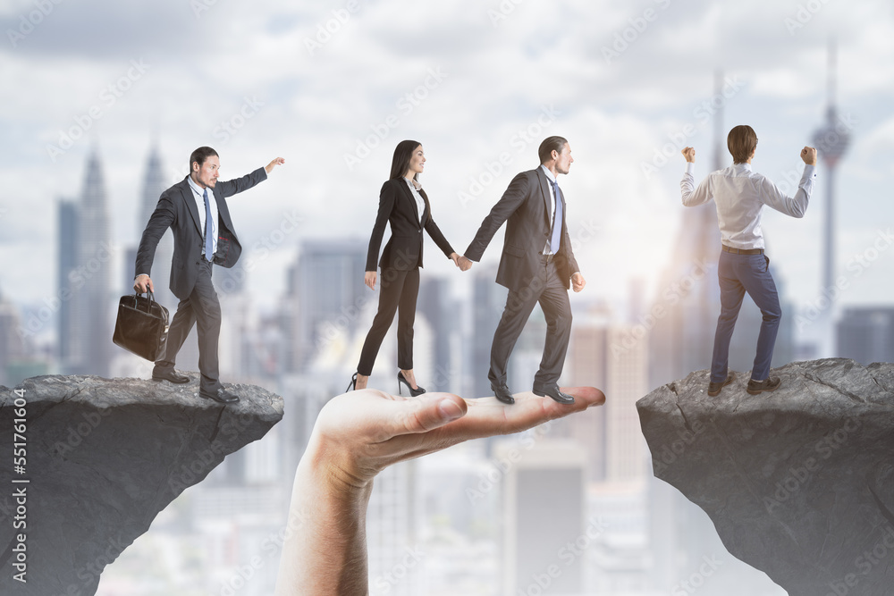 Contemporary image of team helping each other walk through difficulty ...