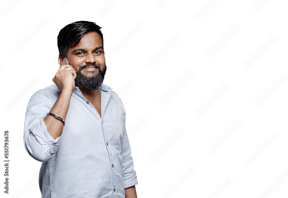 Happy young Indian man with beard talking on the phone with expressive ...