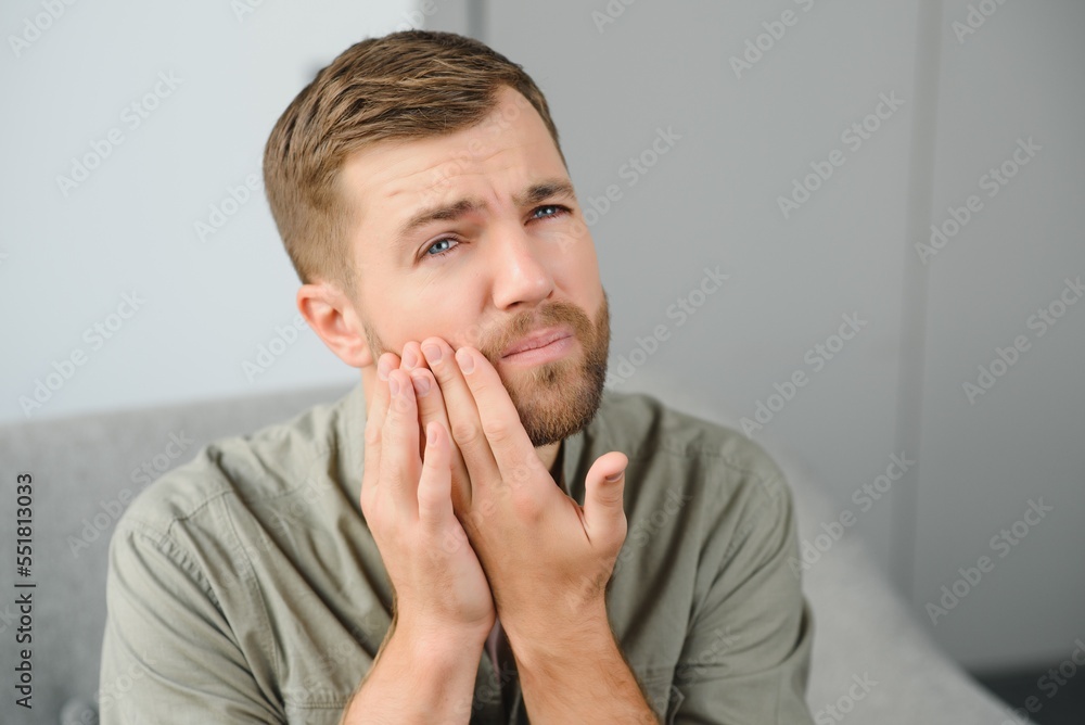 Dental health problems concept. Man suffering from strong toothache ...