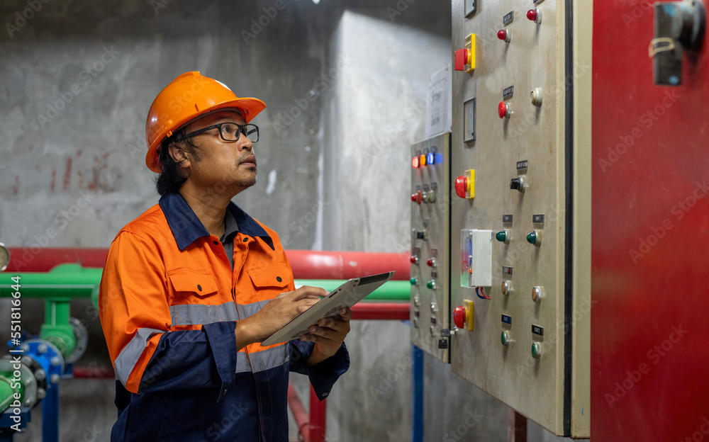 engineer under checking the industry cooling tower air conditioner is ...