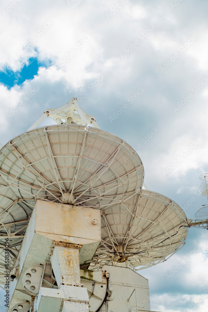 Old powerful antennas. Stationary radar dishes in a group of four on a ...