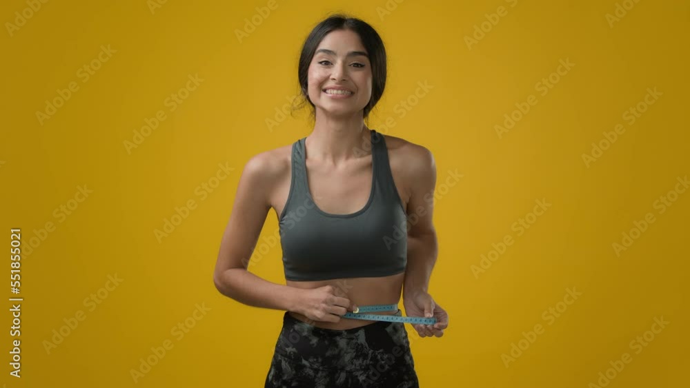 Indian strong slim sport woman girl athlete lady with measure tape ...