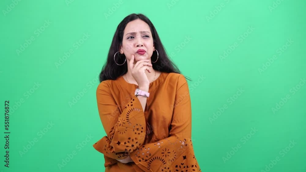 Thoughtful Indian girl student in to deep thinking finding solution ...