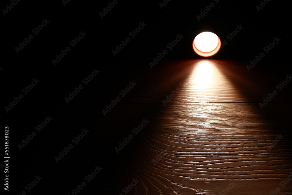Flashlight and a beam of light in darkness. A modern led light with ...