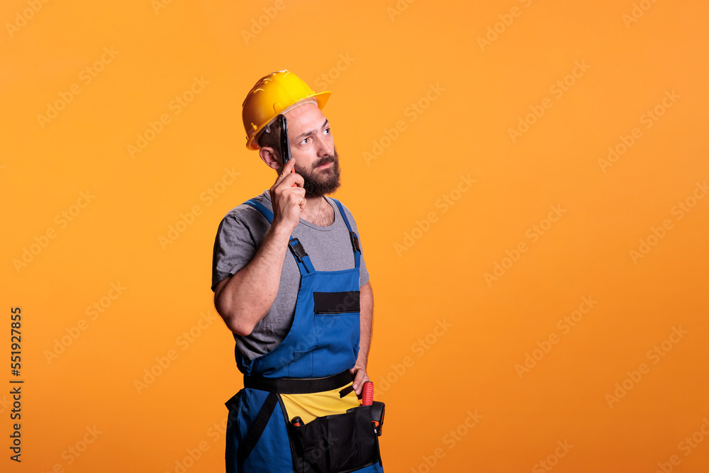 Pensive construction worker thinking about renovating work ...