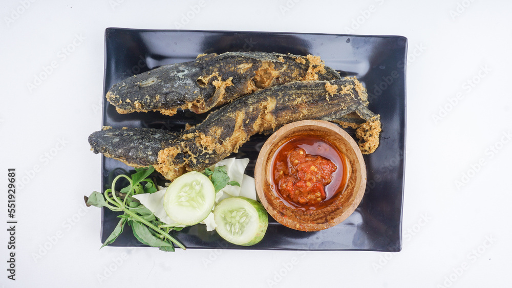 Pecel catfish is a typical Indonesian street food, fried catfish eaten ...