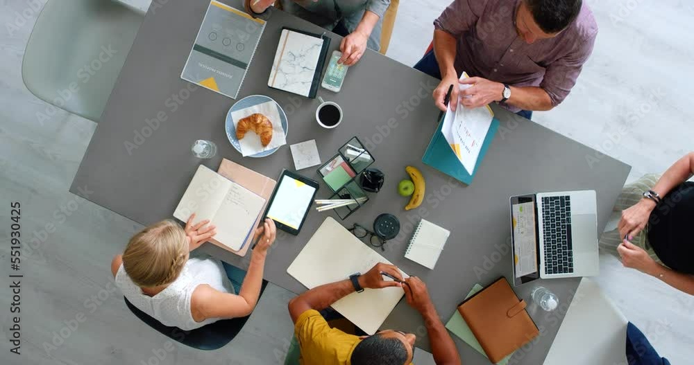 Meeting, planning and collaboration with a team sitting around a table ...