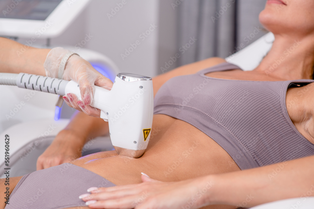 Professional Beautician Removes Hair On Beautiful Female Tummy Using A 0449