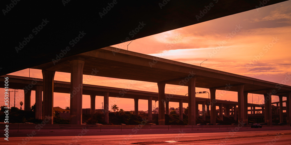 Highway overpass interchange in the city street at sunset, abstract ...