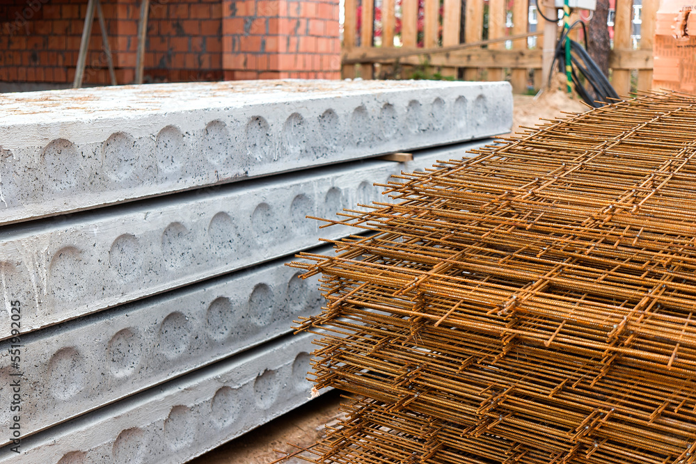 Reinforced concrete floor slabs are stored at the construction site ...