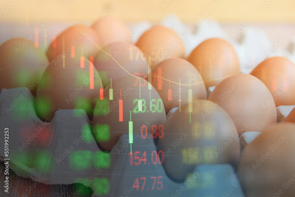 Egg on box with stock market graph chart - food consumer goods ...