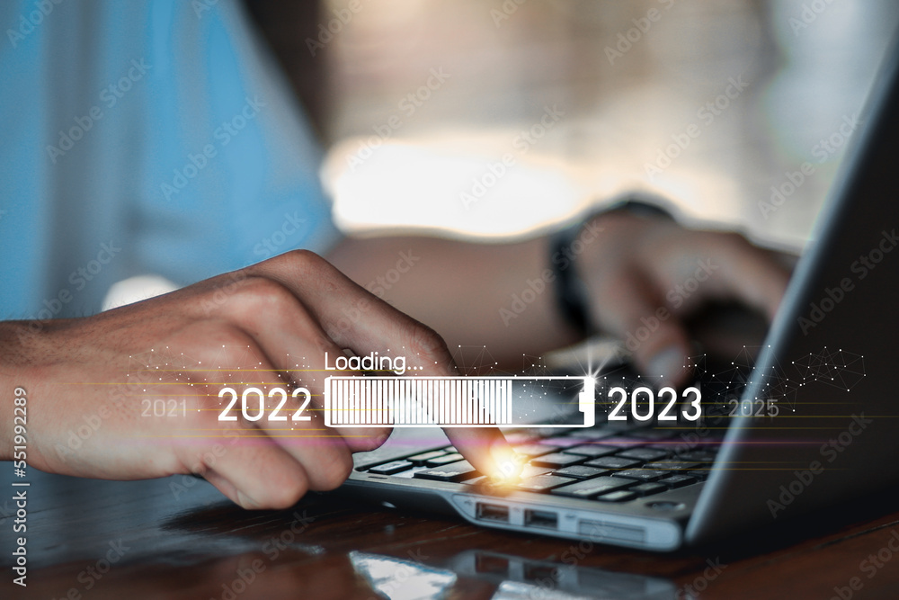 Countdown to 2023 concept. the taps a virtual download bar with a ...