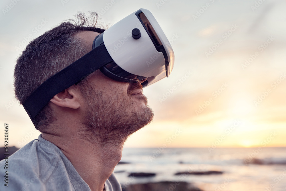 VR, beach and metaverse with a man in a nature using a wireless headset to access the internet ...