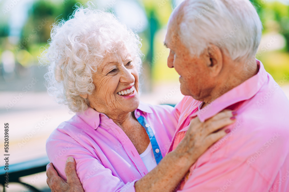 Old modern couple dressing fashionable colored clothes. Youthful ...