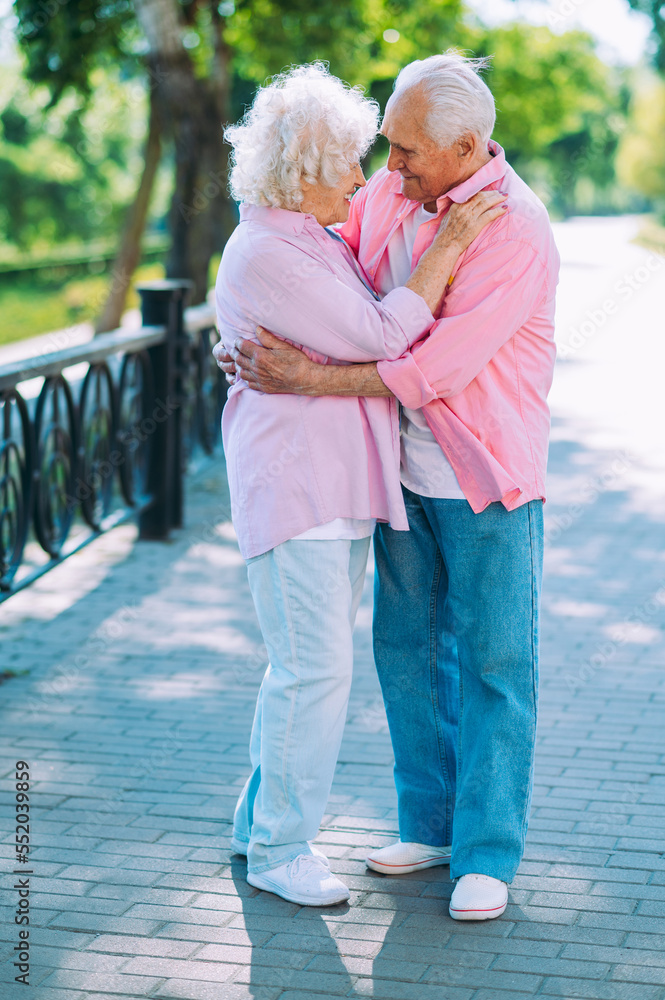 Old modern couple dressing fashionable colored clothes. Youthful ... Old modern couple dressing fashionable colored clothes. Youthful ...
