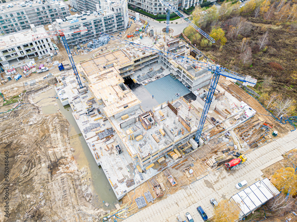 Aerial view of construction site with crane and building. Top view of ...