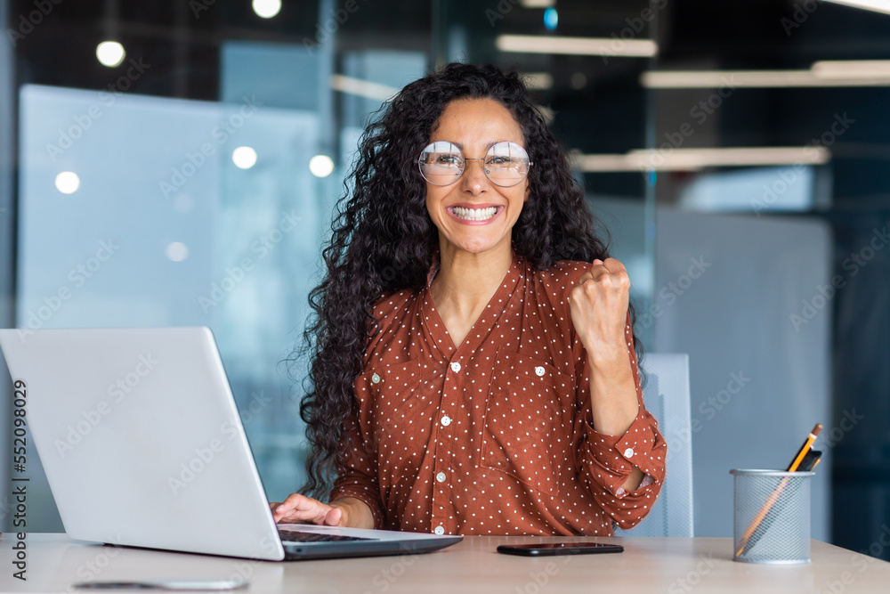 Portrait successful Hispanic business woman office worker with curly ...
