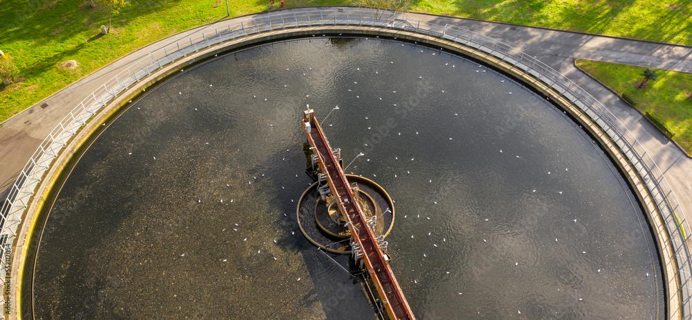 Aerial view of the tanks of a sewage and water treatment plant enabling ...