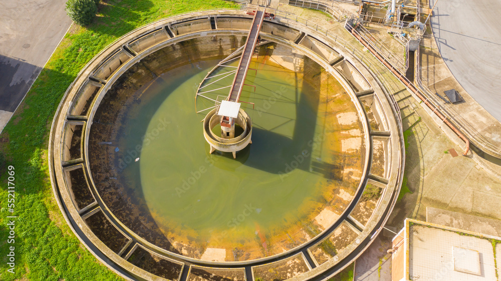 Aerial view of the tanks of a sewage and water treatment plant enabling ...