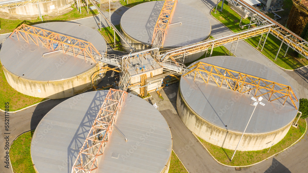 Aerial view of the tanks of a sewage and water treatment plant enabling ...