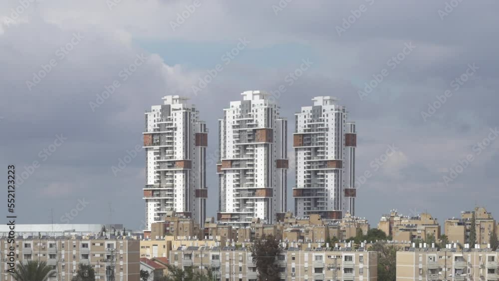 New high buildings tower over an old low-rise buildings district with ...