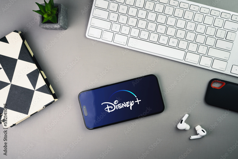Disney+ (Disney Plus) streaming app on the smartphone screen on grey ...