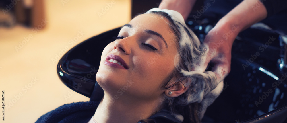 Hairdresser washing hair of the woman in modern hair salon Stock Photo ...