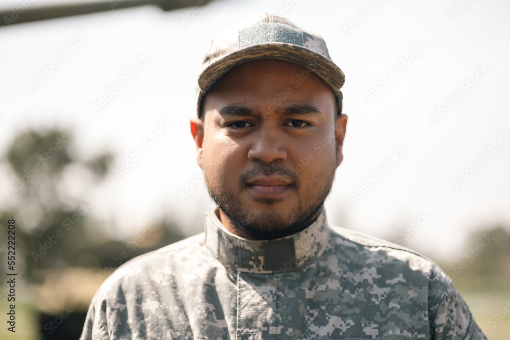 Asian man special forces soldier standing against on the field Mission ...