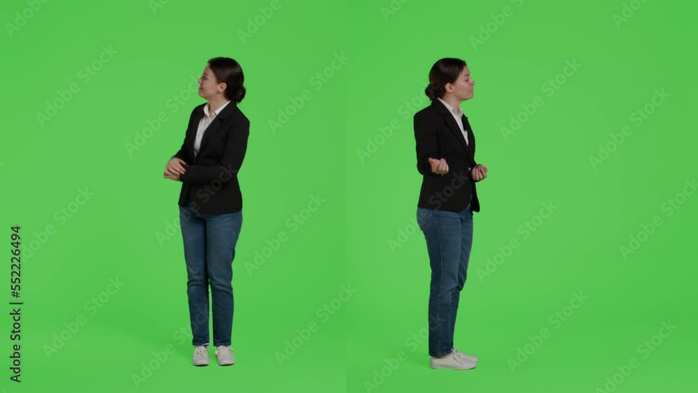 Female manager doing advertisement over full body greenscreen backdrop ...