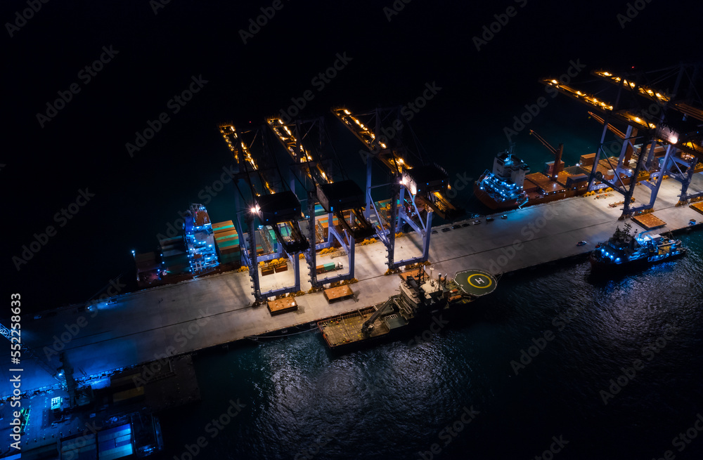 Aerial view of international port with crane loading containers in ...