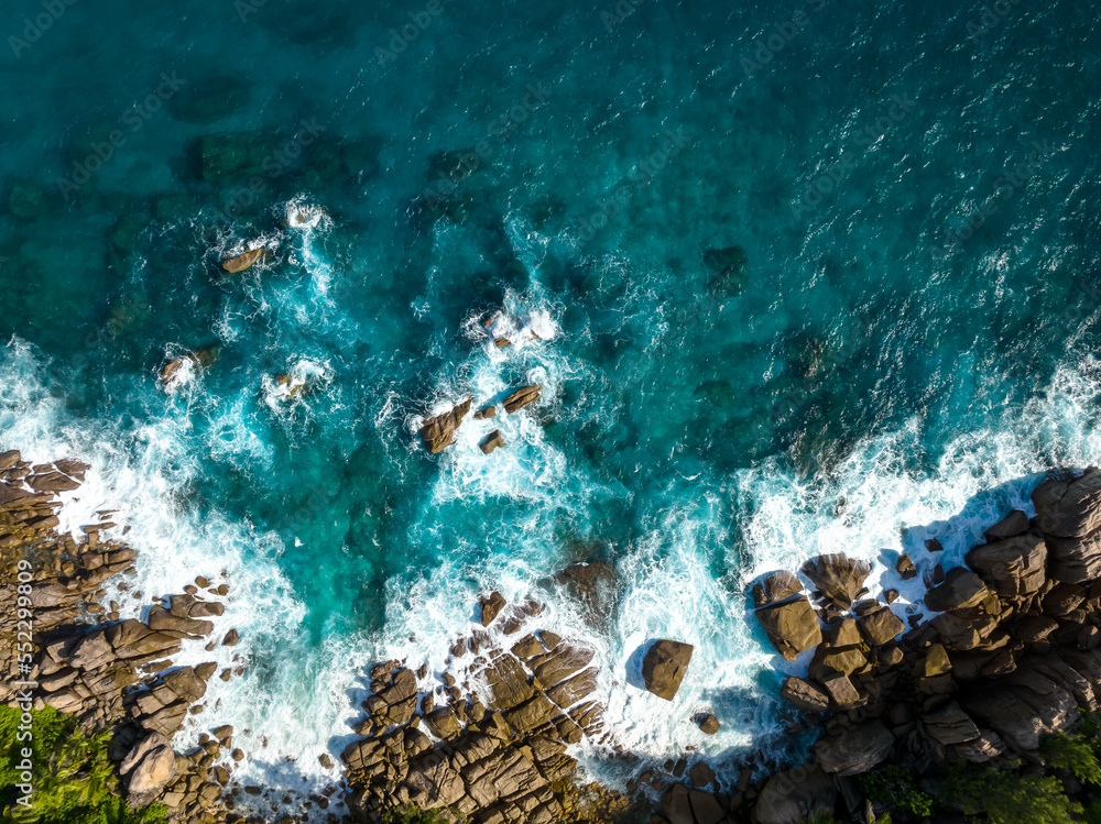 Aerial view Top down seashore. Waves crashing on rock cliff. Beautiful ...