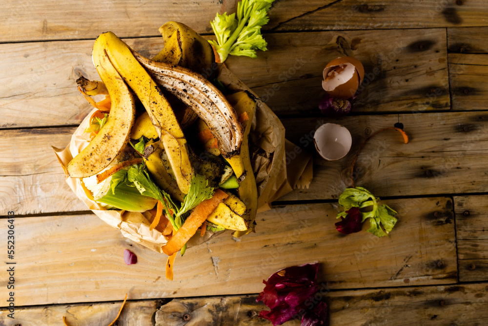 Overhead of organic fruit and vegetable food waste spilling from full ...