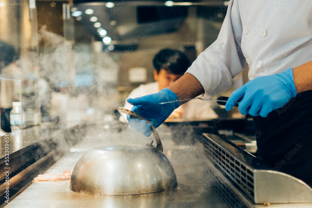 Hand of man take cooking of meat with vegetable grill, Chef cooking ...