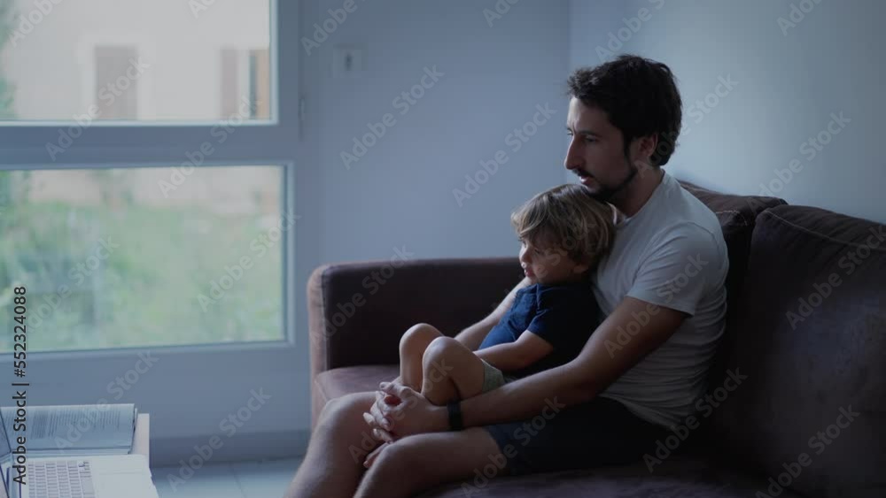 Father and son hanging out together in home couch. Candid child on dad ...