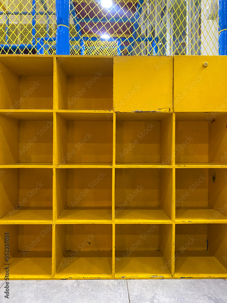 empty shoe rack in a newly built kindergarten Stock Photo | Adobe Stock